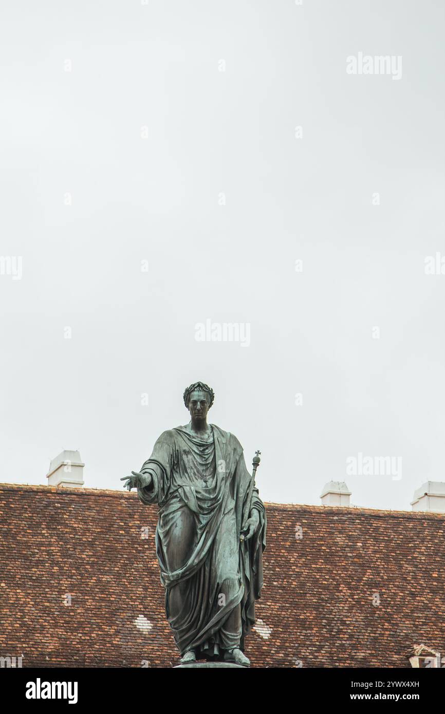 Vienna, Austria - May 12, 2019: Bronze statue in front of historical ...