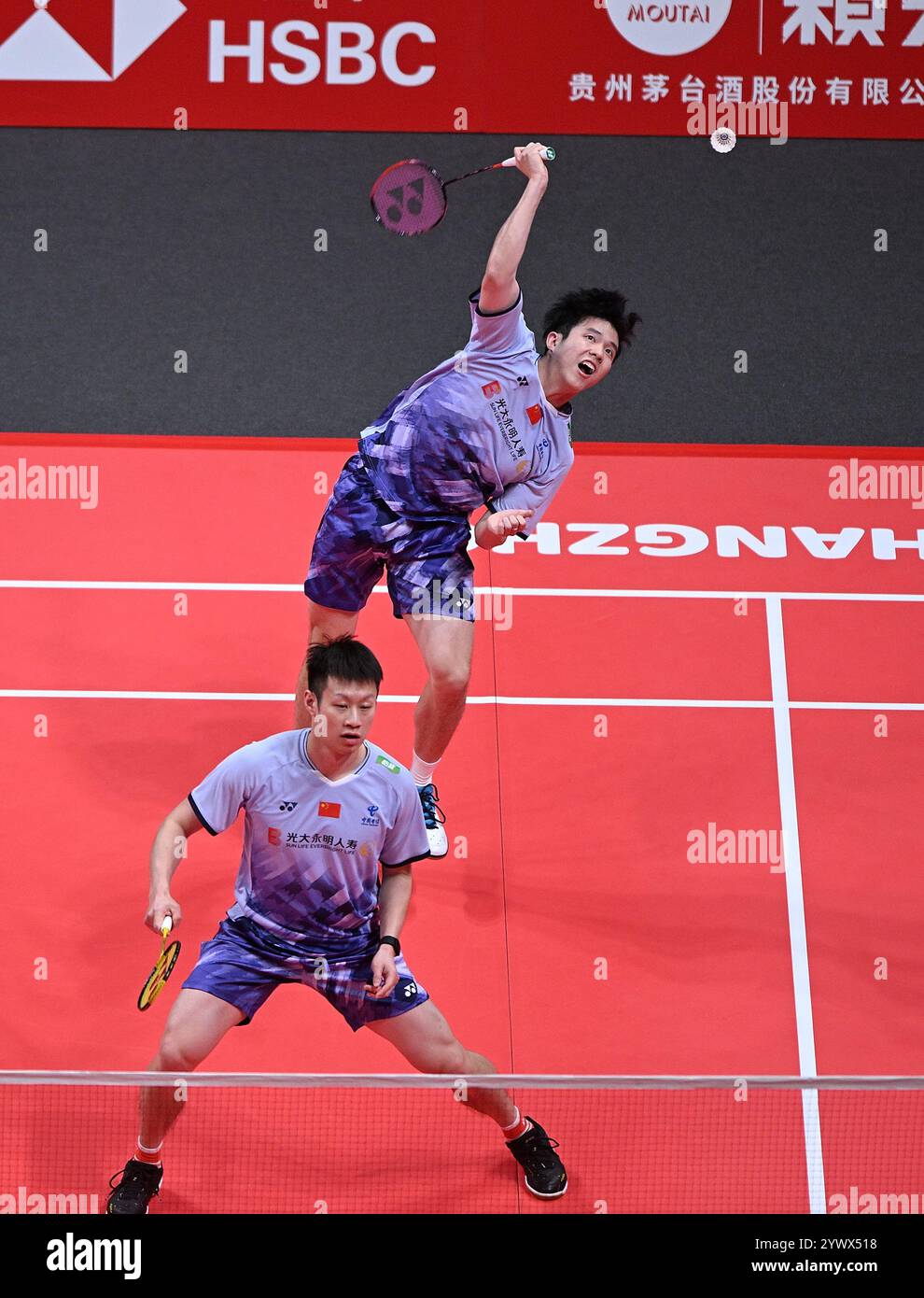 Hangzhou, China. 12th Dec, 2024. He Jiting (top)/Ren Xiangyu compete ...