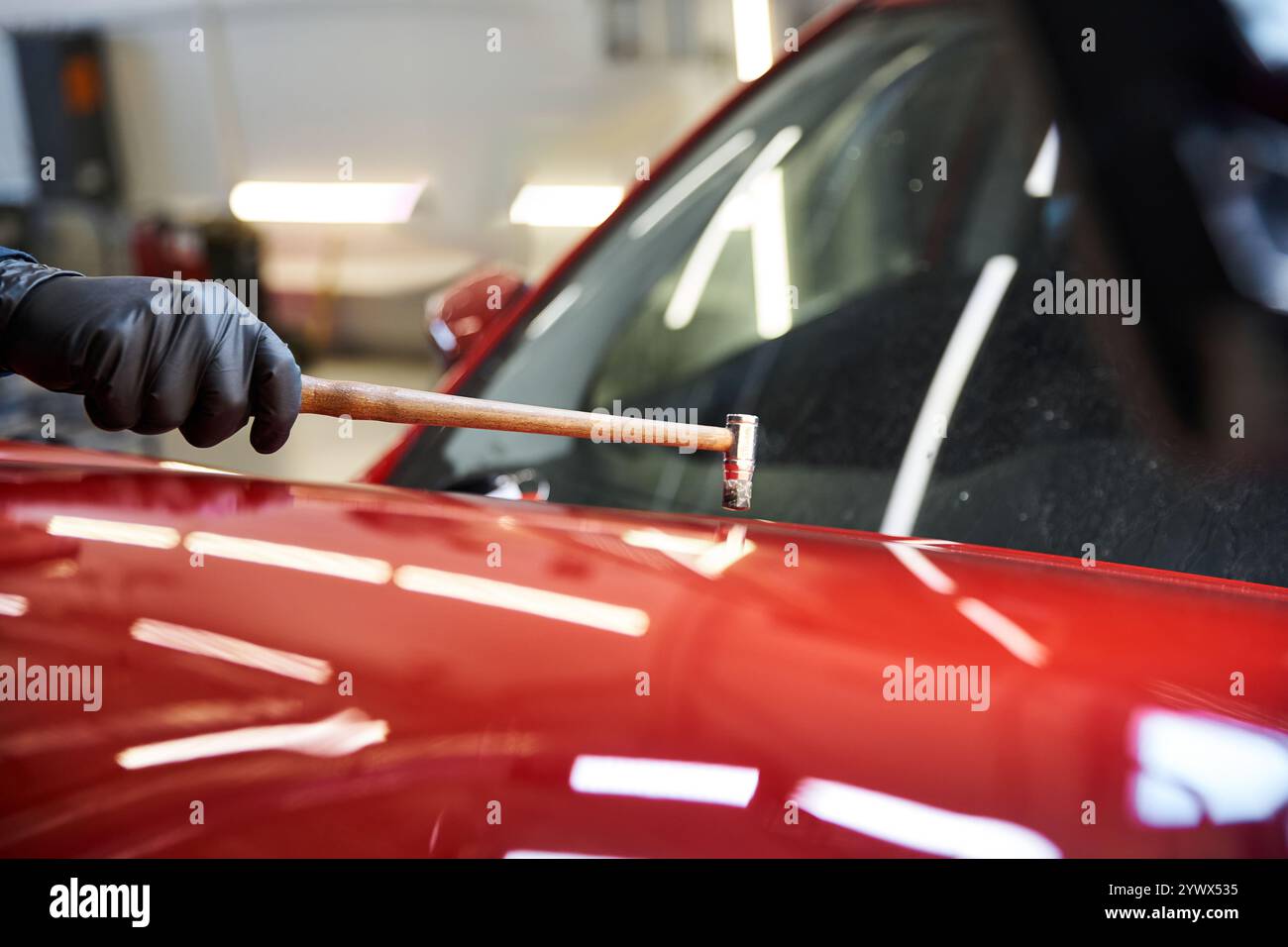 Car mechanic fixing a red car hi-res stock photography and images - Alamy