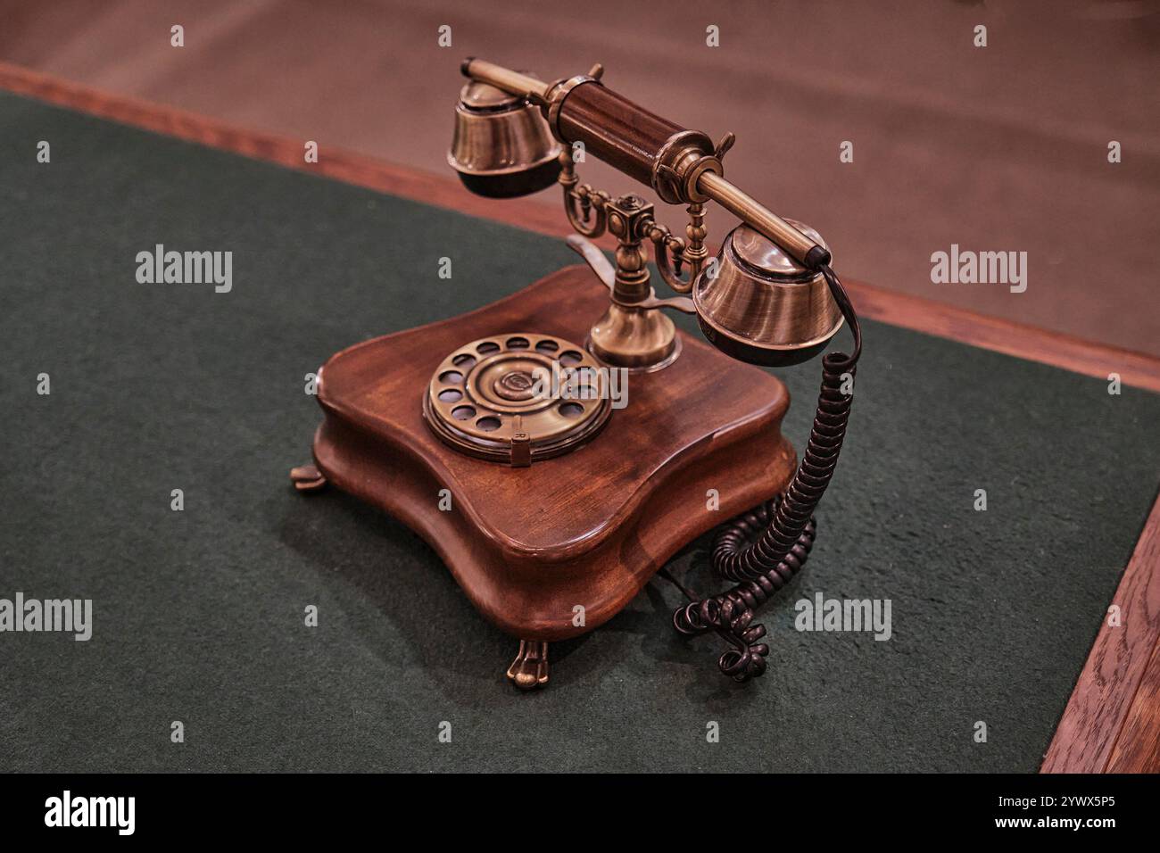 Retro style home phone from the late 19th century, made of wood and ...
