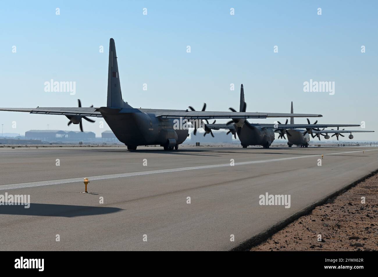 U.S. Air Force and coalition partnered aircraft taxi onto the runway to ...
