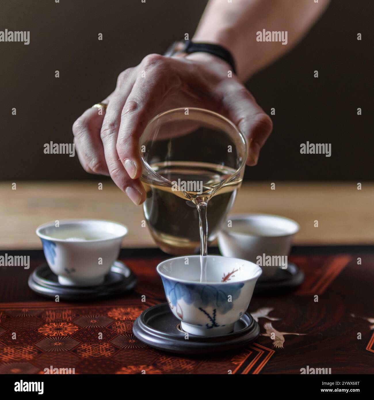An Elegant and Graceful Tea Ceremony Pouring Traditional Tea into ...