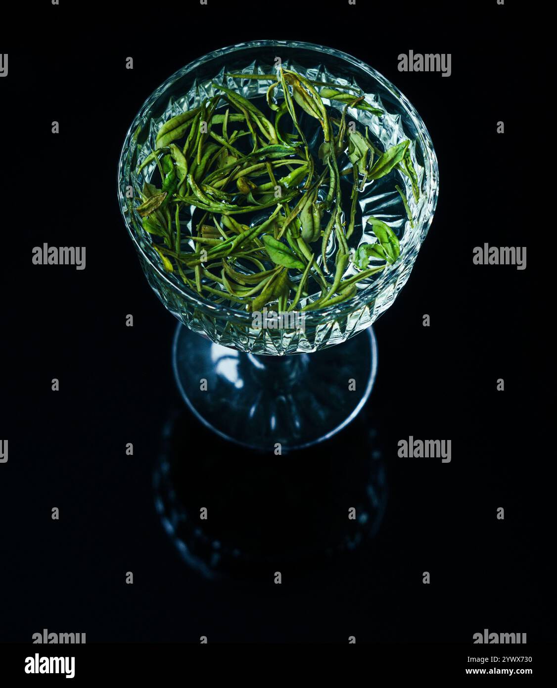 An Elegant and Tasteful Display of Beautifully Curled Green Tea Leaves ...