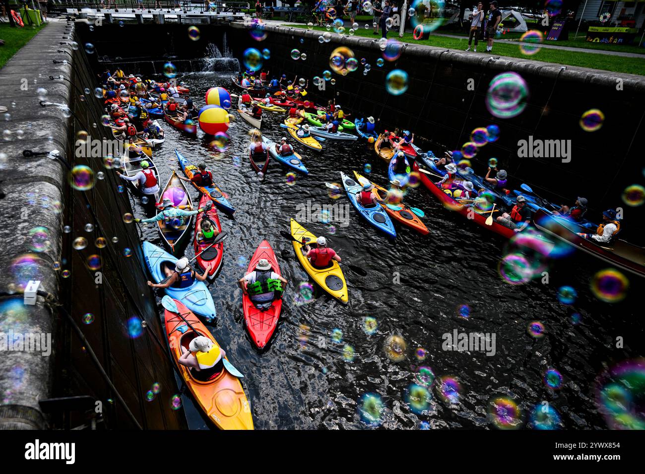 Bubbles float in the air over paddlers as they enter the locks at ...