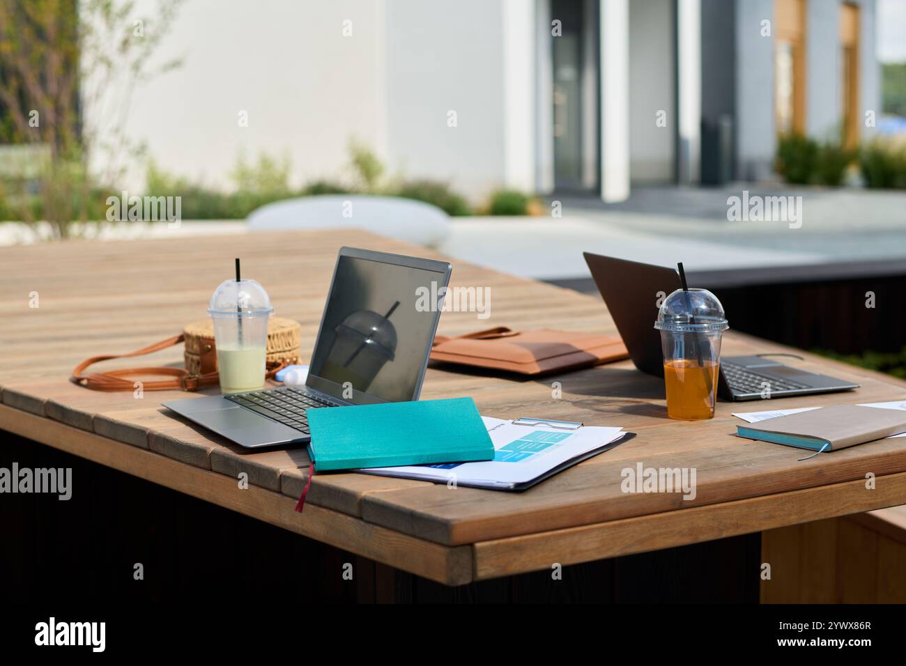 Outdoor Workspace with Laptops and Refreshments Stock Photo - Alamy