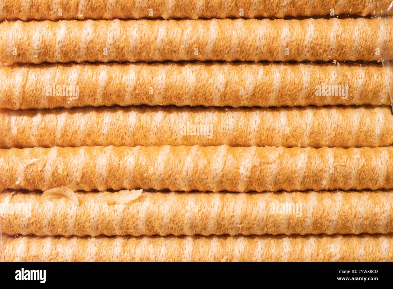 background of sandy sweet tubes in a bakery Stock Photo - Alamy