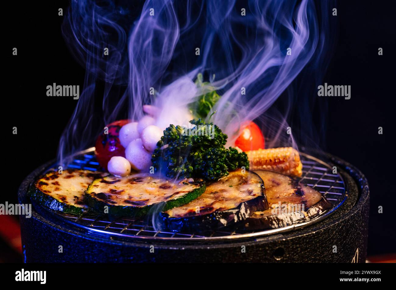 Smoky grilled vegetables on mini grill Stock Photo - Alamy