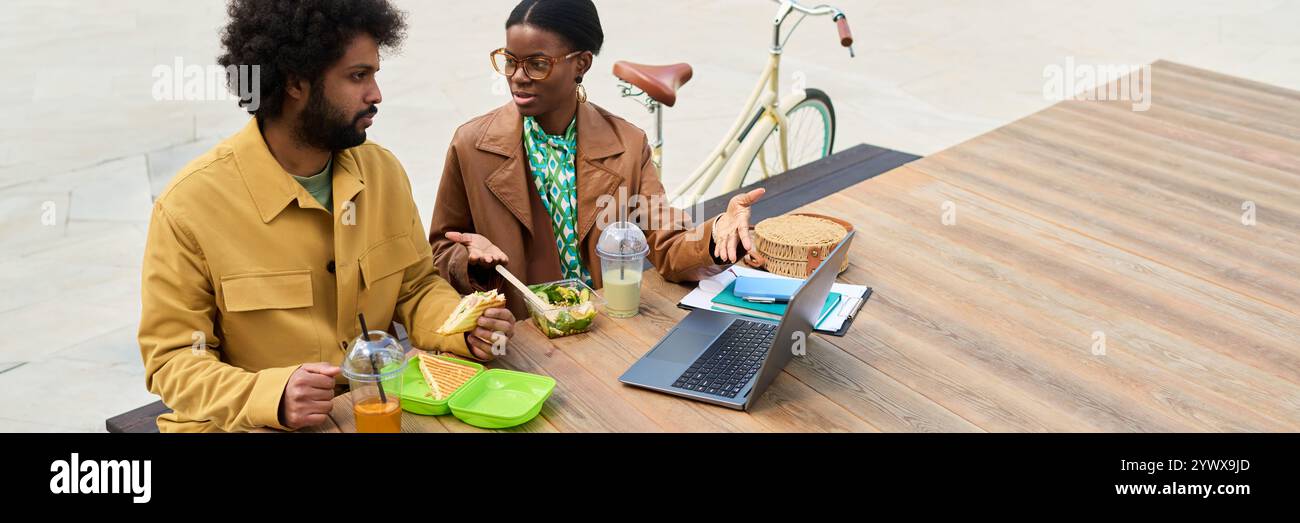 Discussing Work During Outdoor Lunch Break Stock Photo - Alamy