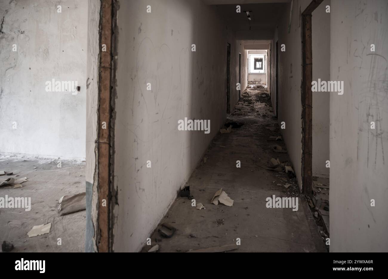 Abandoned, destroyed corridor in a residential building, Soviet apartment blocks, ghost town ...