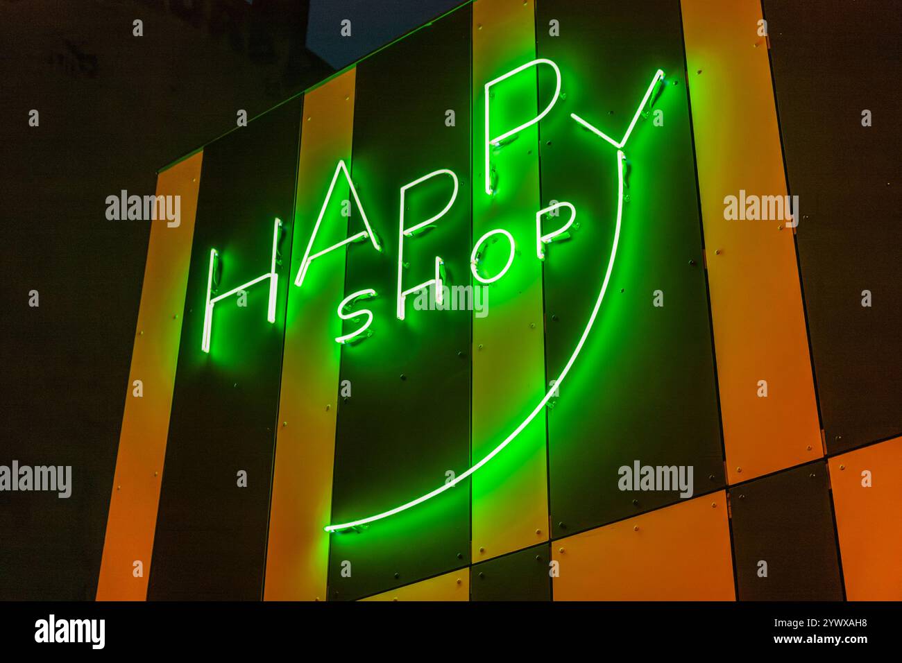 Berlin, Germany 6 August 2012. Happy shop neon sign in the color green ...