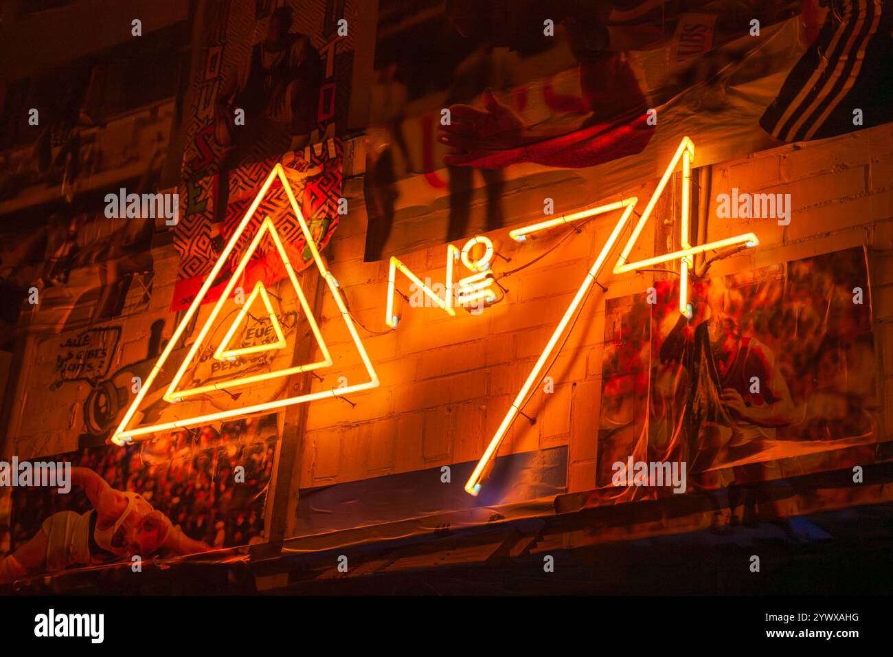 Berlin, Germany 6 August 2012. no. 74 neon sign in the color orange ...