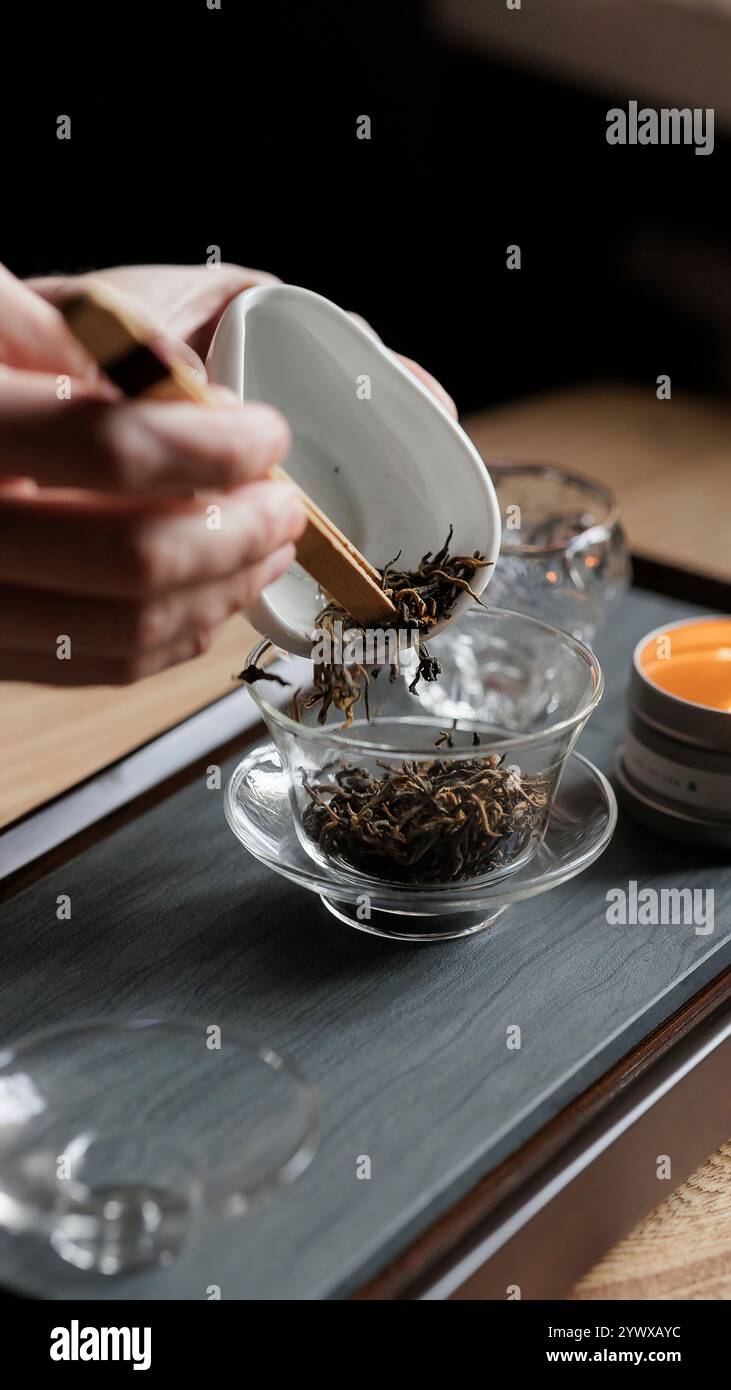 The preparation of tea using loose leaves and a dedicated tea set ...