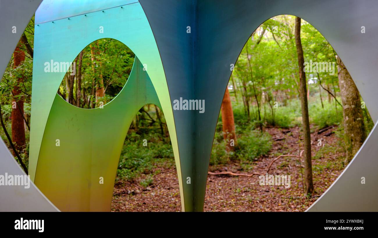 Crescent-shaped windows cut into titanium plates, nestled within a ...