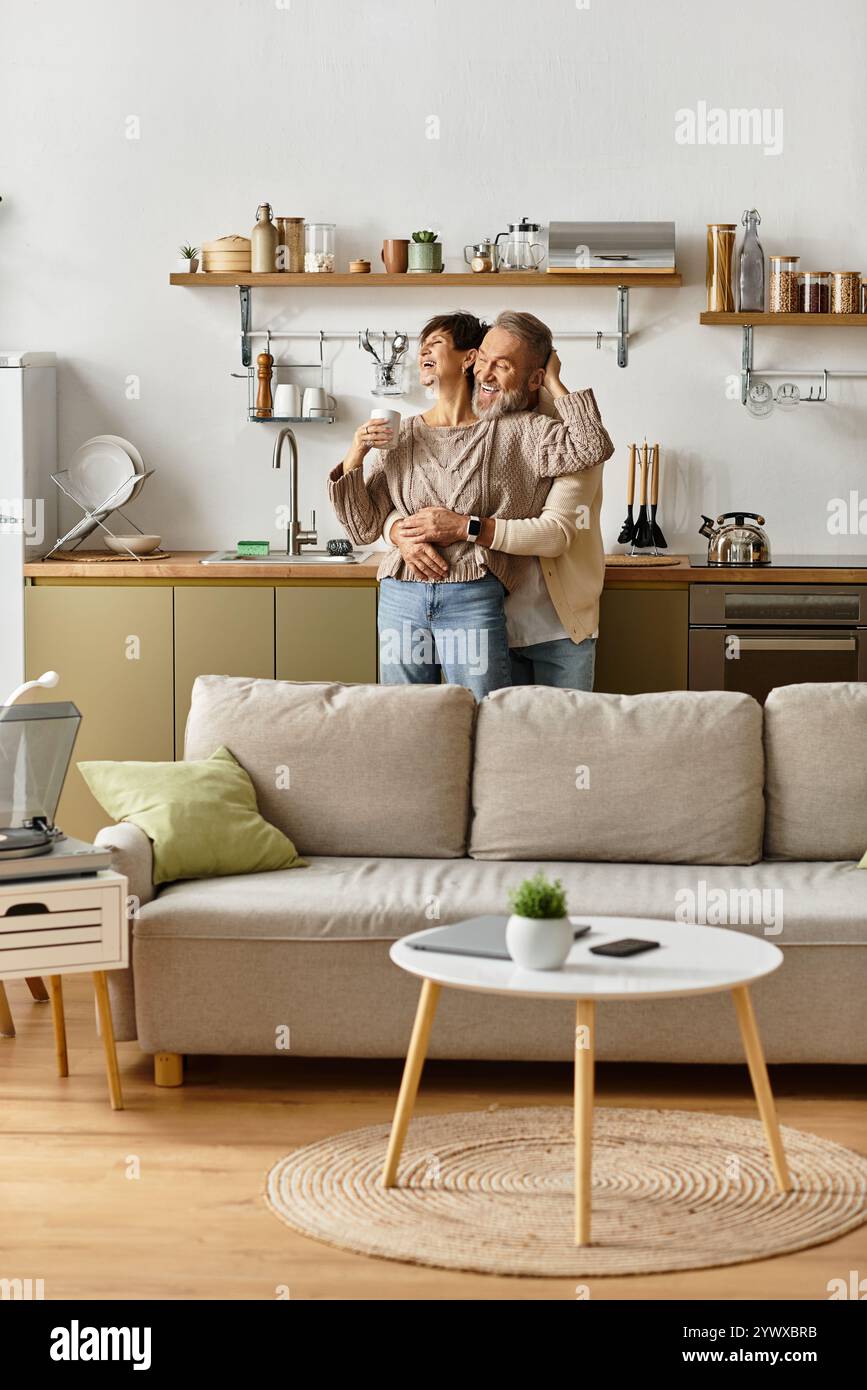 A cheerful couple shares laughter while preparing breakfast in their ...
