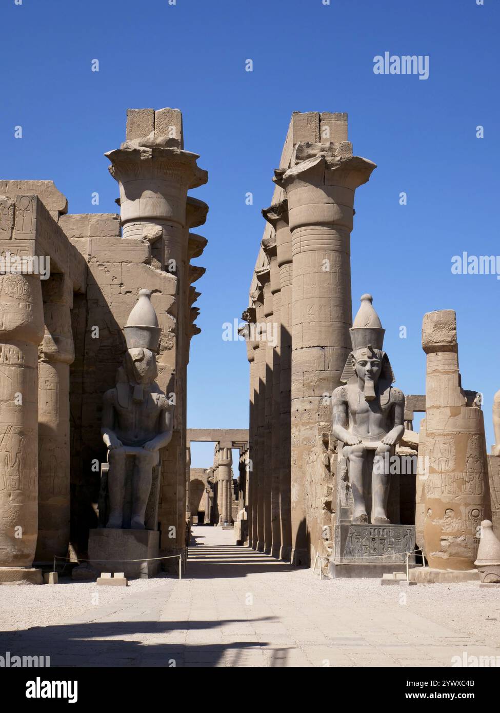 Columns and colossus of Ramesses II in the Temple of Amon, Luxor, Egypt ...