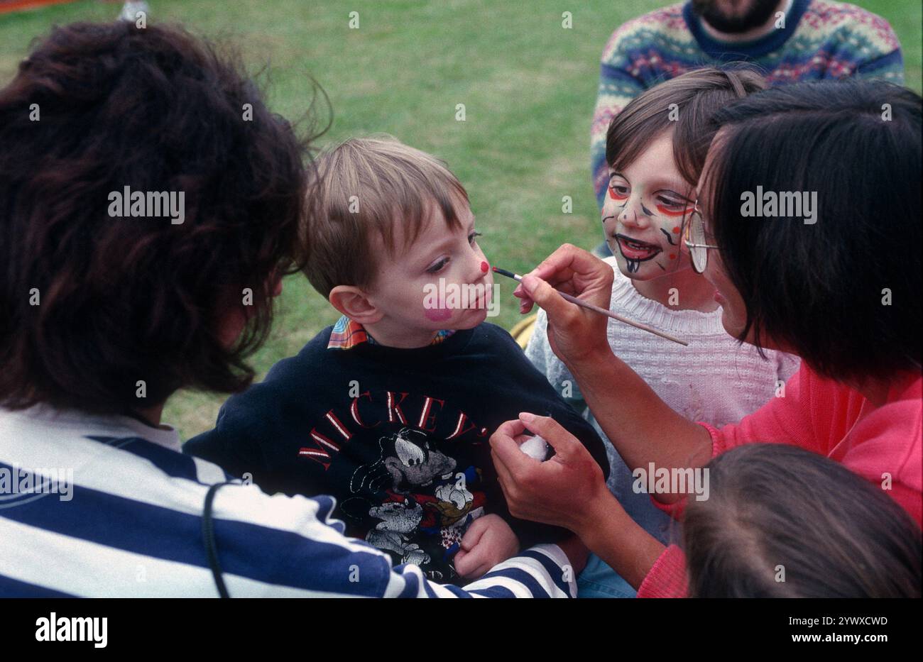 A primary school pupil having face makeup for a Parent Teacher day out ...