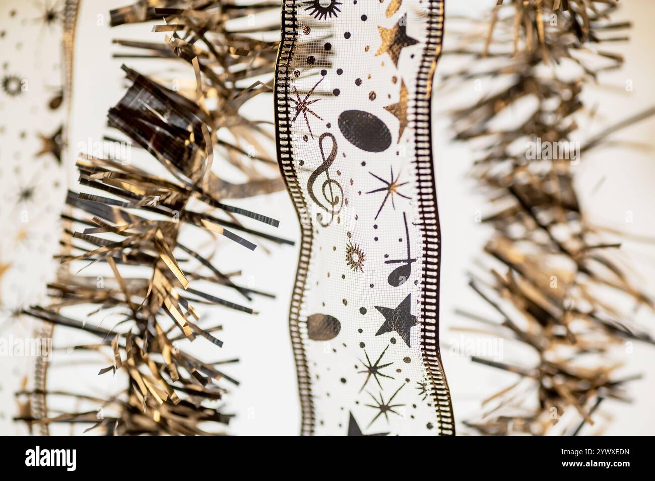 Decorative bow with small star, dot and violin key and glossy golden ...