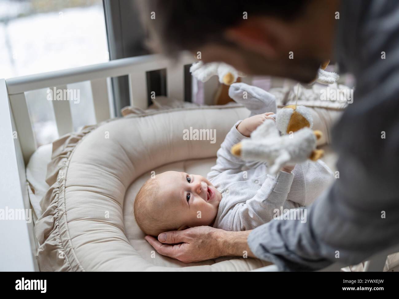 Father on paternity leave looking after his infant son at home Stock ...