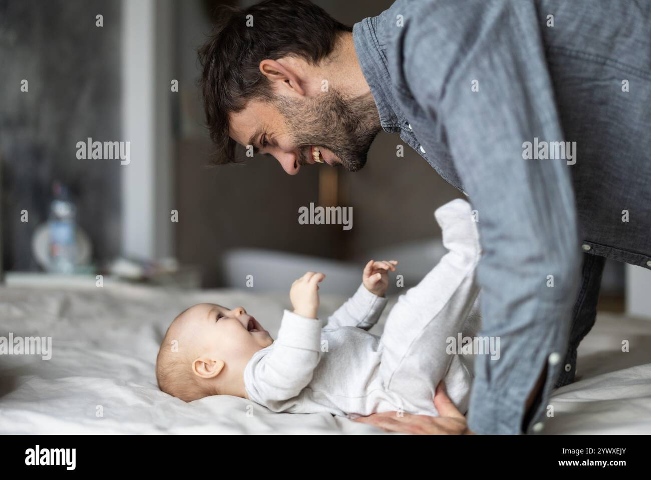 Father on paternity leave looking after his infant son at home Stock ...