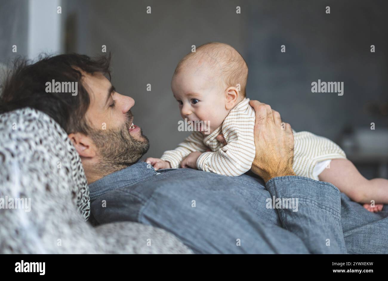Father on paternity leave looking after his infant son at home Stock ...