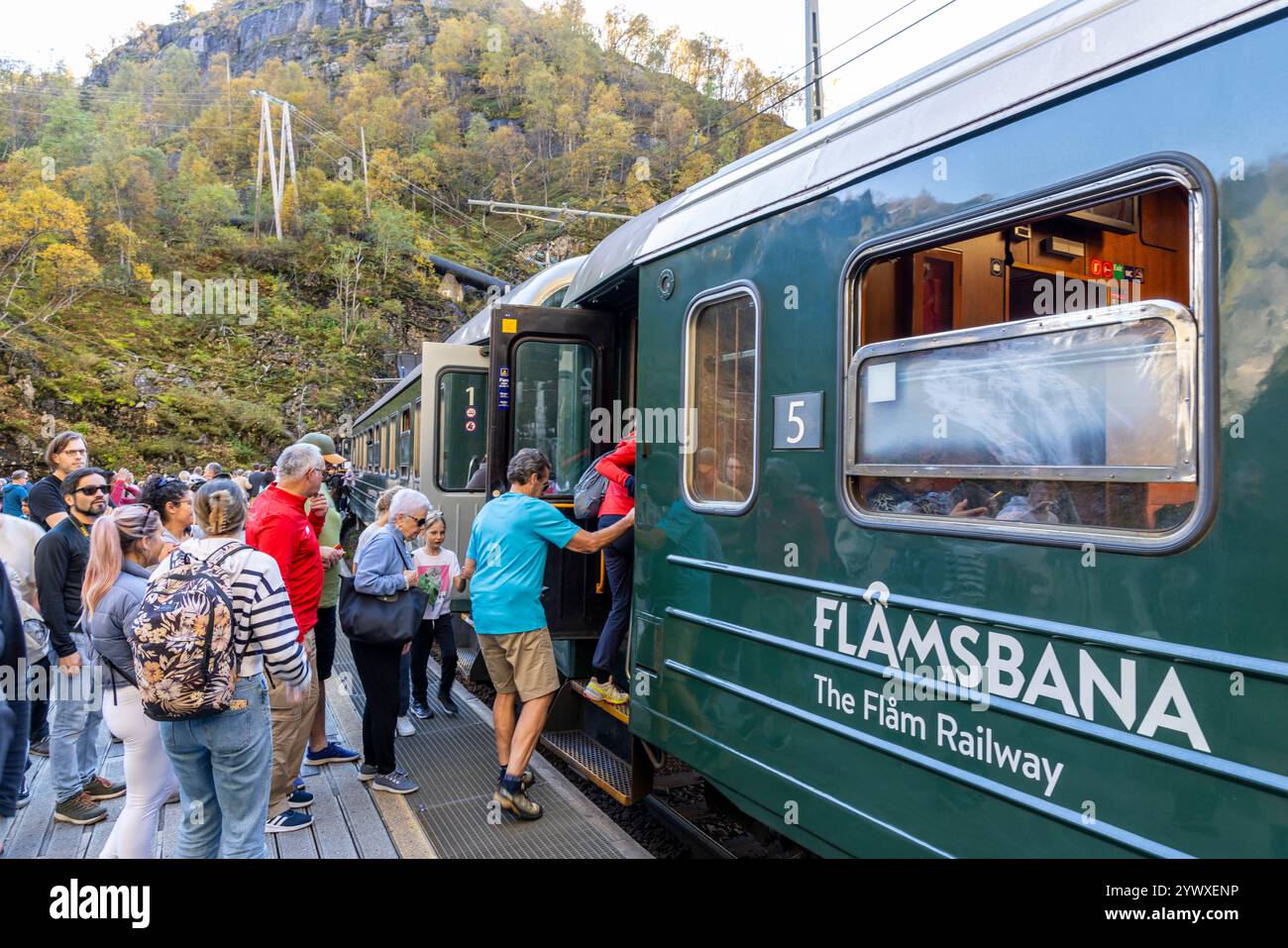 Tourists boarding the Flam railway train after a brief stop to view the Kjosfossen waterfall on ...