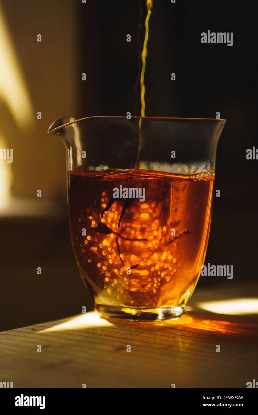 Pouring a Refreshing Cup of Tea into a Glass While Capturing Beautiful ...
