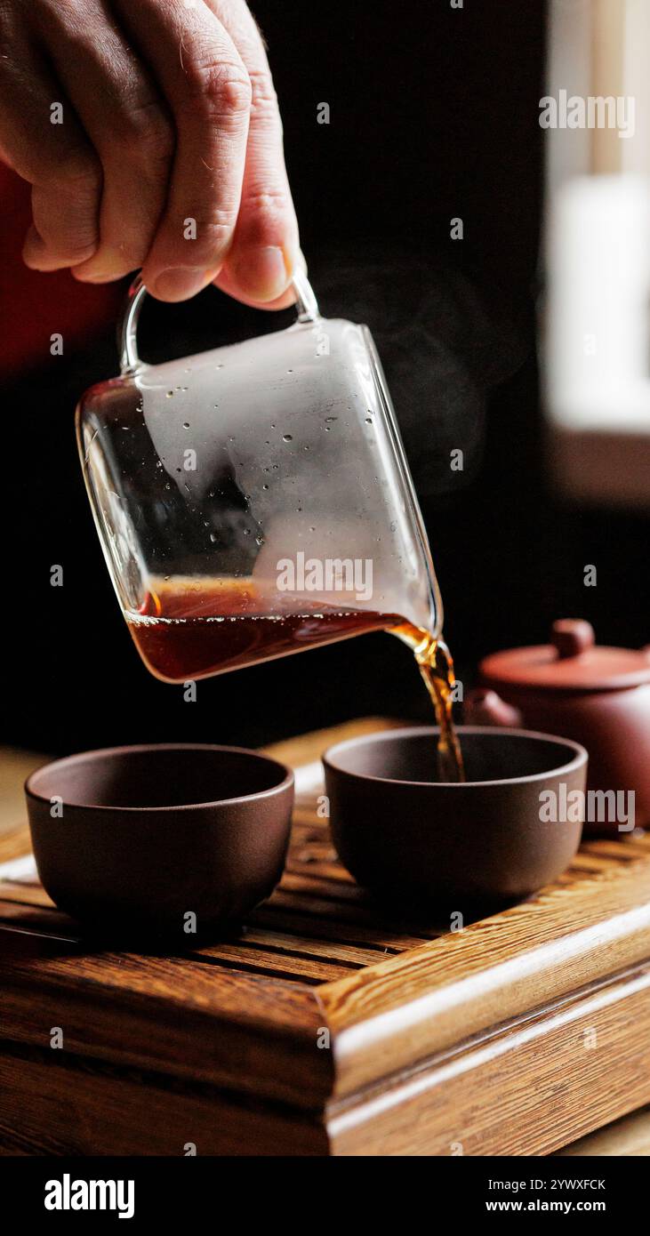 The Artful Tea Pouring Process in a Traditional Setup A Combination of ...