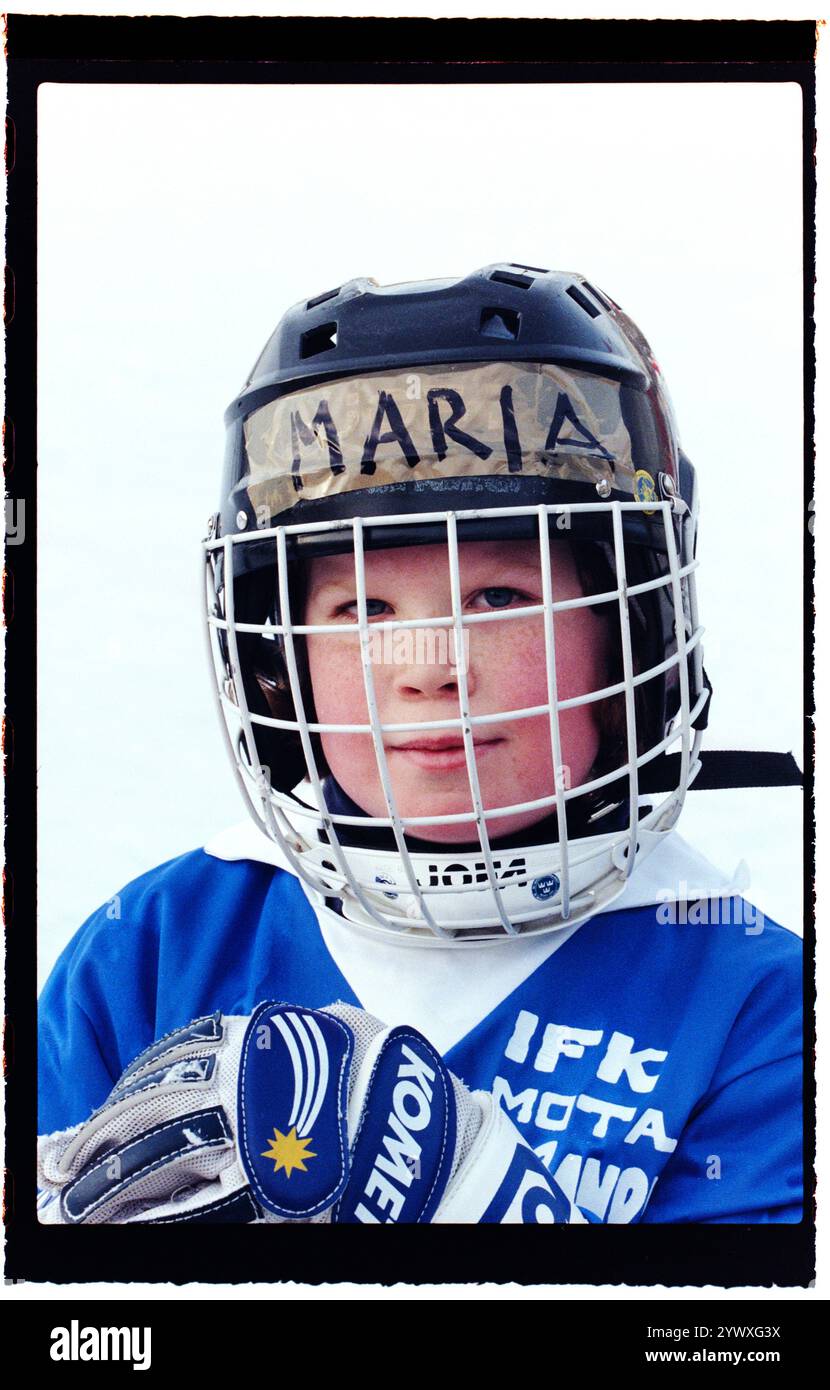 Children and young people during a bandy school on a cold January day ...