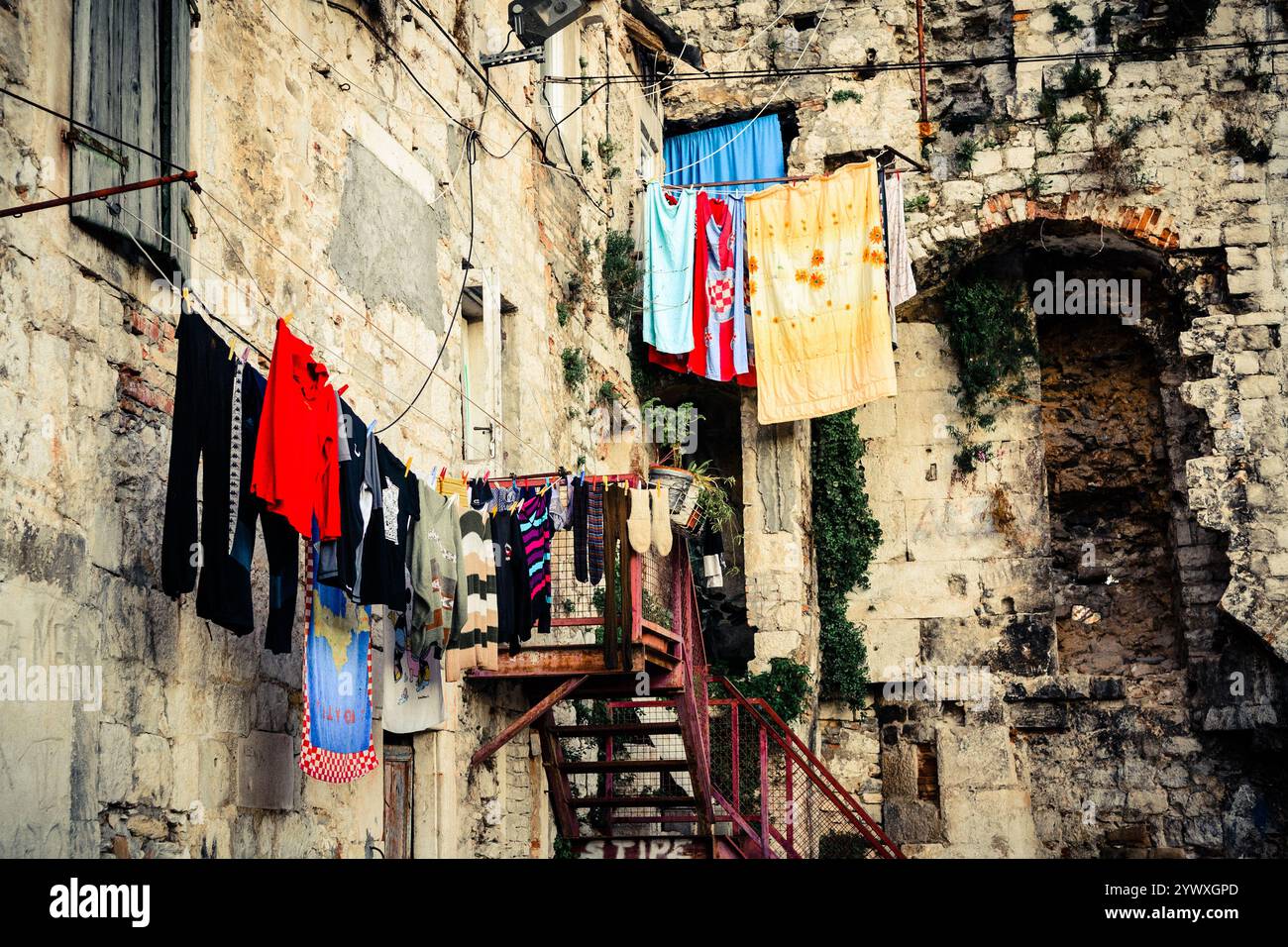 Scenery in old part of town showing laundry day and clothes drying on a ...