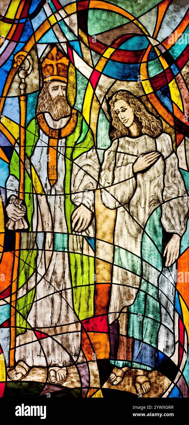 Stained glass showing bishop saint Nicholas and believer Stock Photo ...