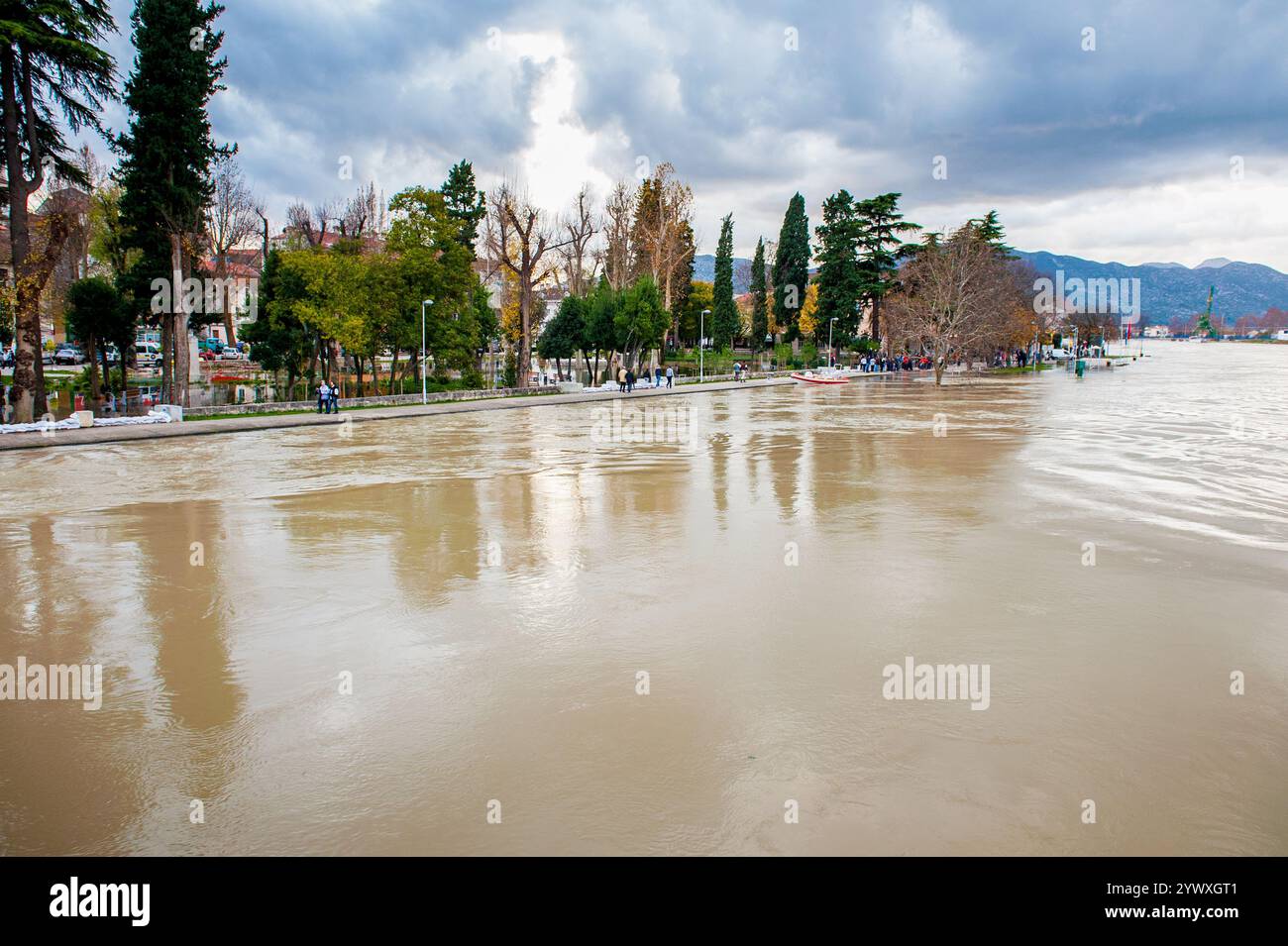 Display of swollen river threatening the city and its people. Dangerous ...