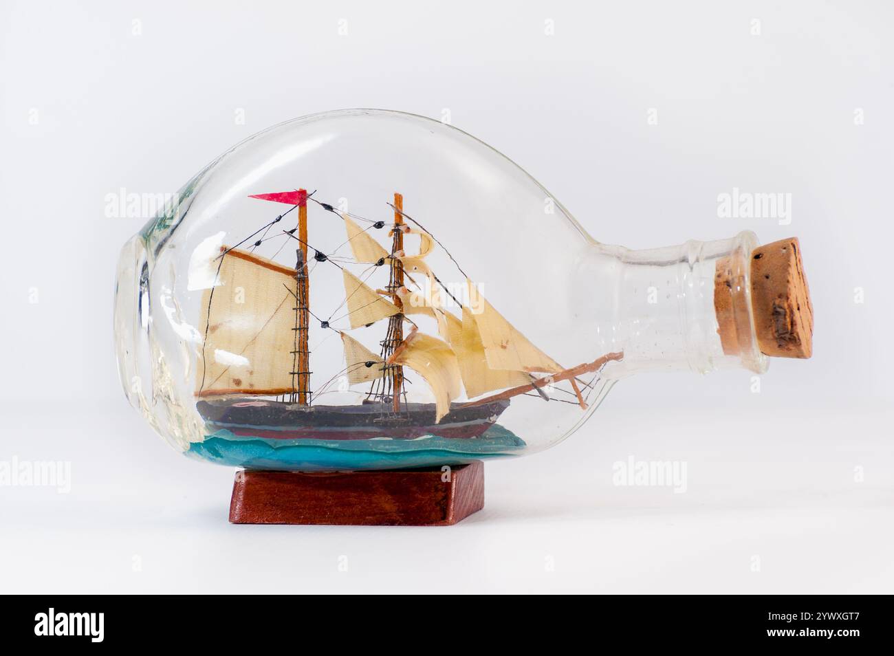 Handmade miniature ship inside a bottle, on white background Stock ...