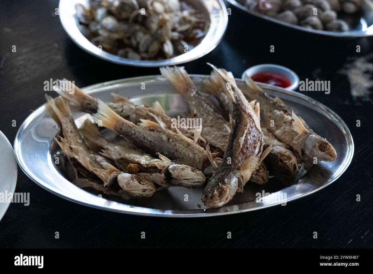 Deep fried fish being served on a dish as lunch in Malaysia Stock Photo ...