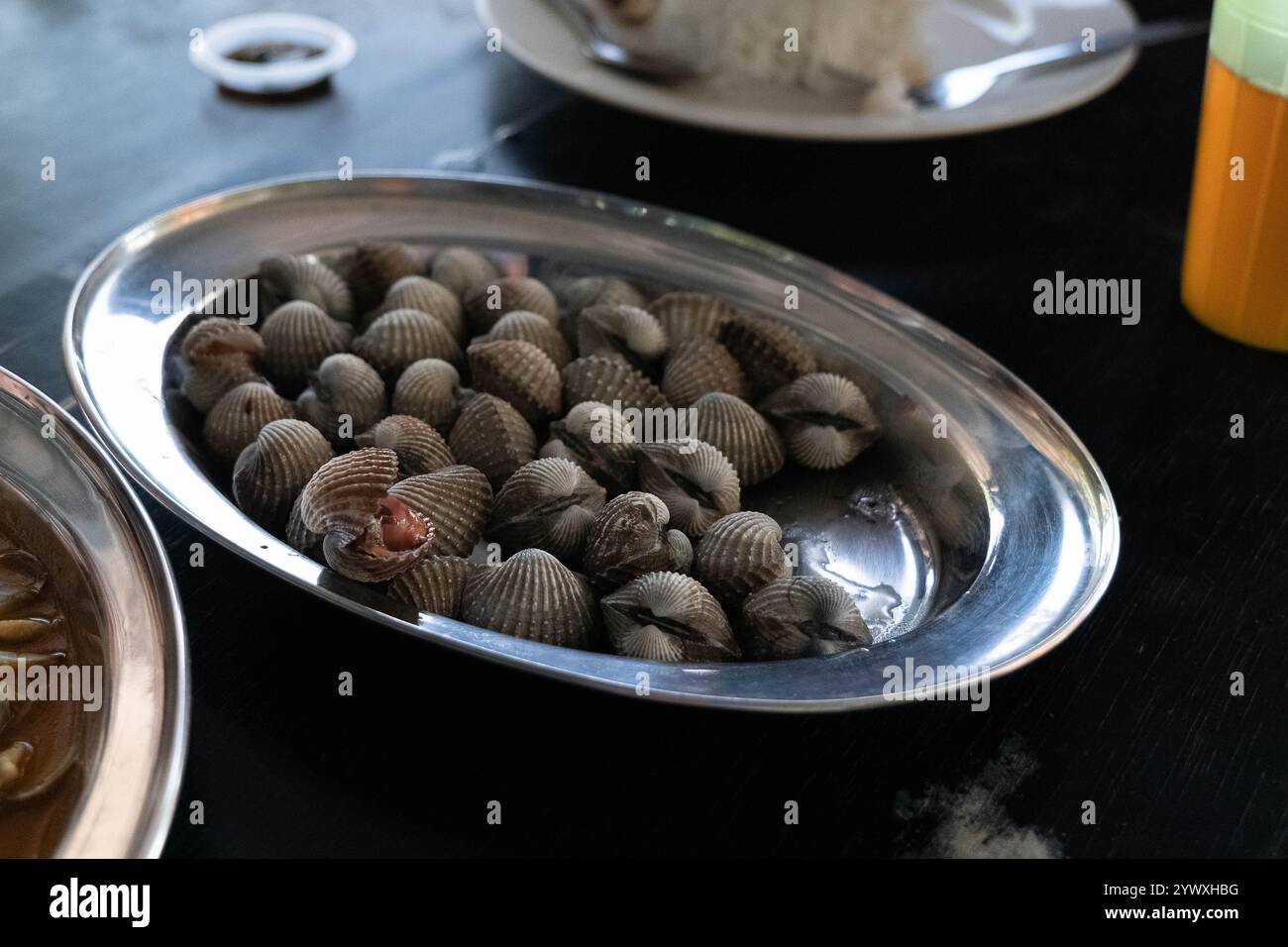 Boiled cockle shell being served as lunch in Malaysia Stock Photo - Alamy