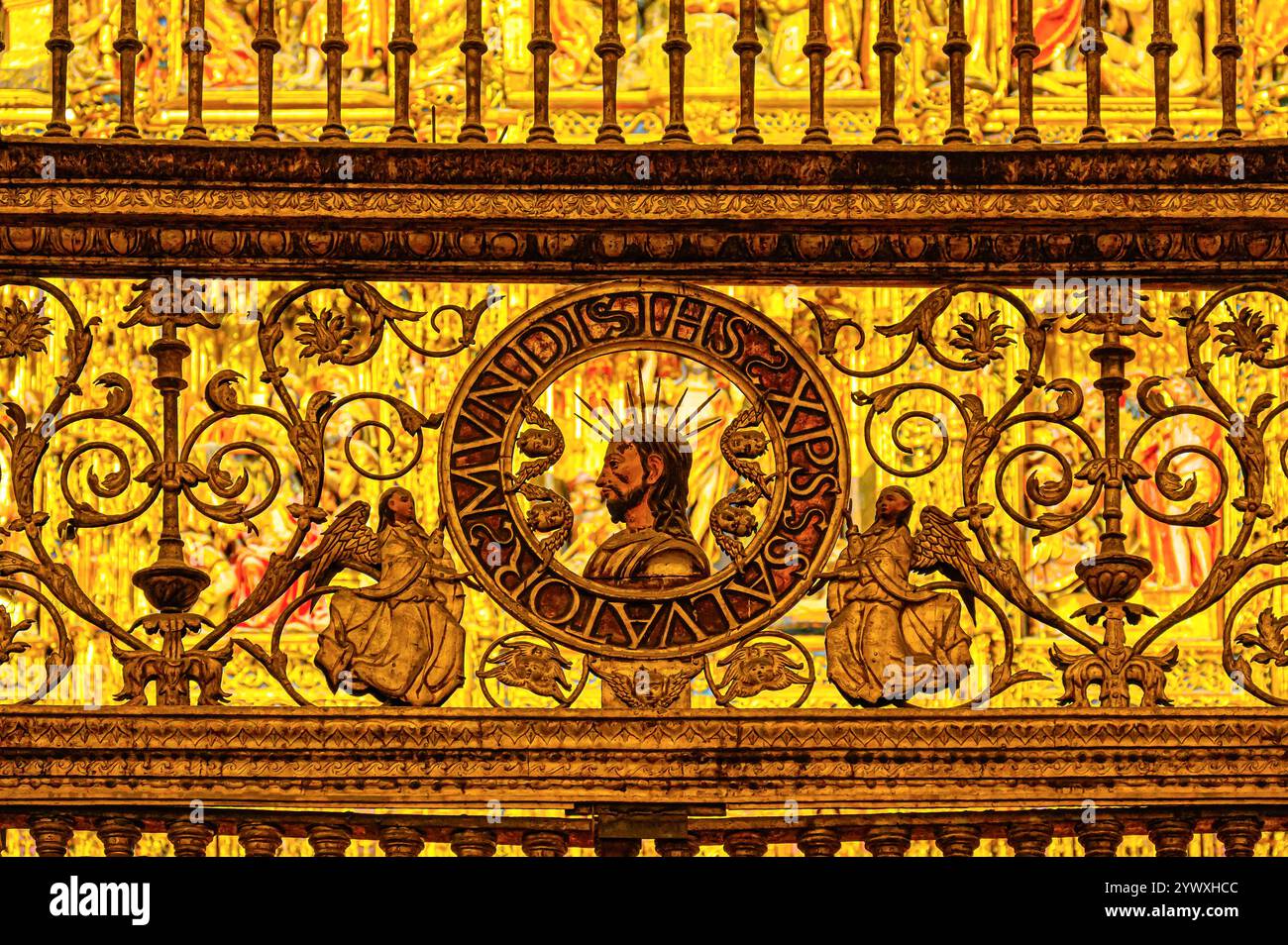 Seville, Spain: A religious saint figure adorning ancient metalwork ...