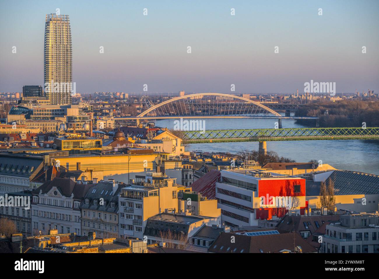 Urban skyline with a modern skyscraper, two river bridges, and a mix of ...