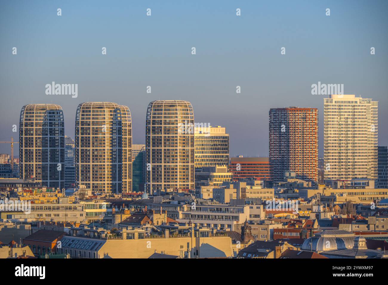 Cityscape with a group of modern high-rise buildings featuring curved ...
