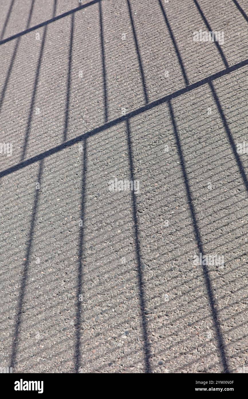 Closeup of shadow of metal fence grid construction background texture ...