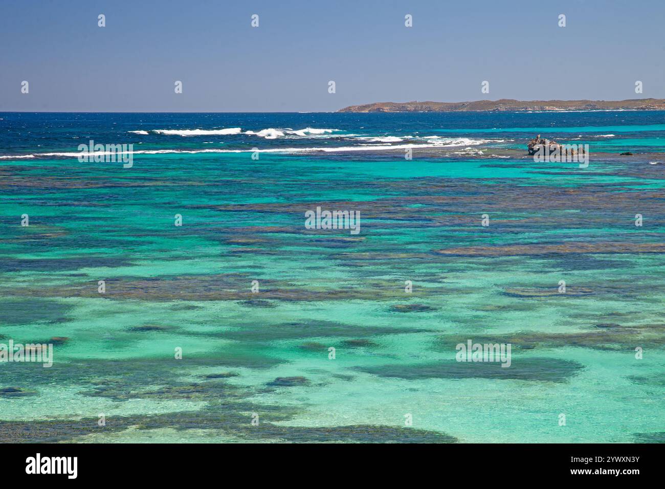 Vivid turquoise ocean waters showcasing coral reefs off Rottnest Island ...