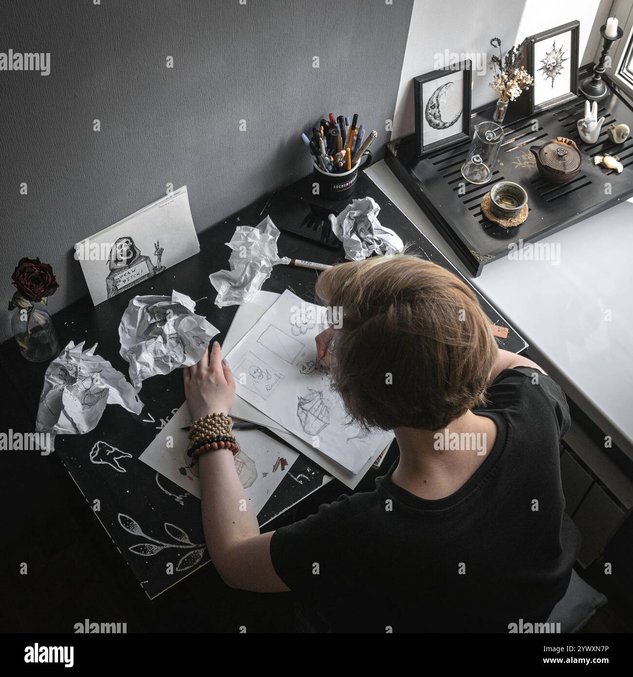 Creative Artist at Their Workstation Sketching Unique Ideas in a Cozy ...