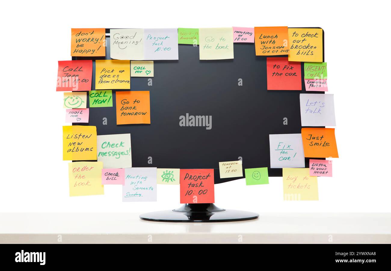 Various note papers on computer monitor, on white background Stock ...