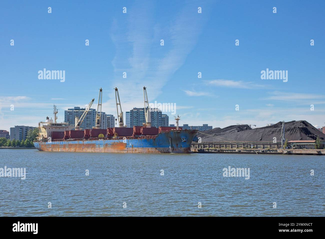 Ship unloading coal at Hanasaari port in sunny summer weather, Helsinki ...