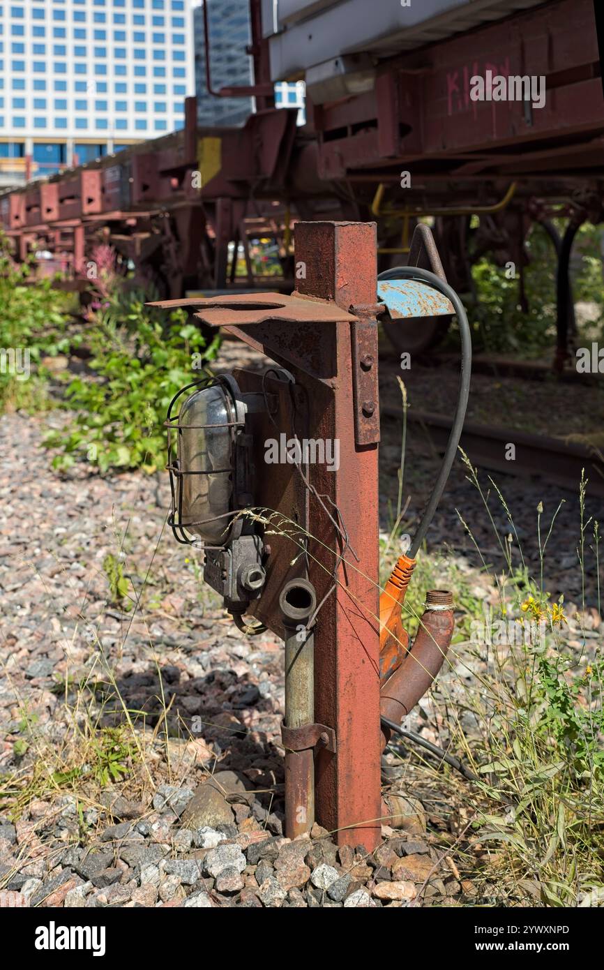Closeup of old lamp and electrical junction box at railway freight ...