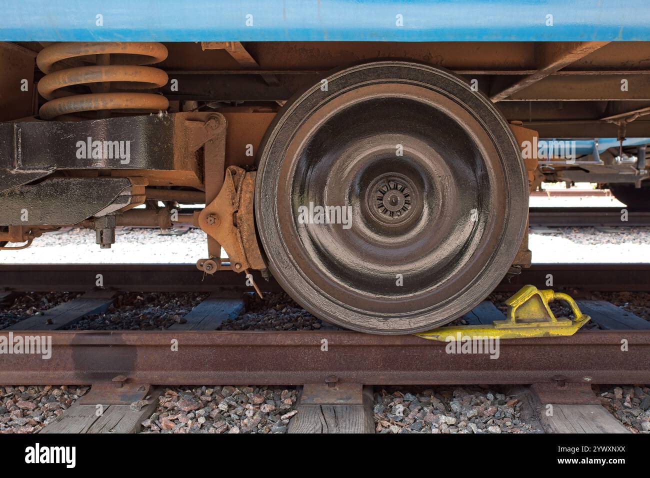Closeup of wheel and brake of a railway car with yellow stopper Stock ...