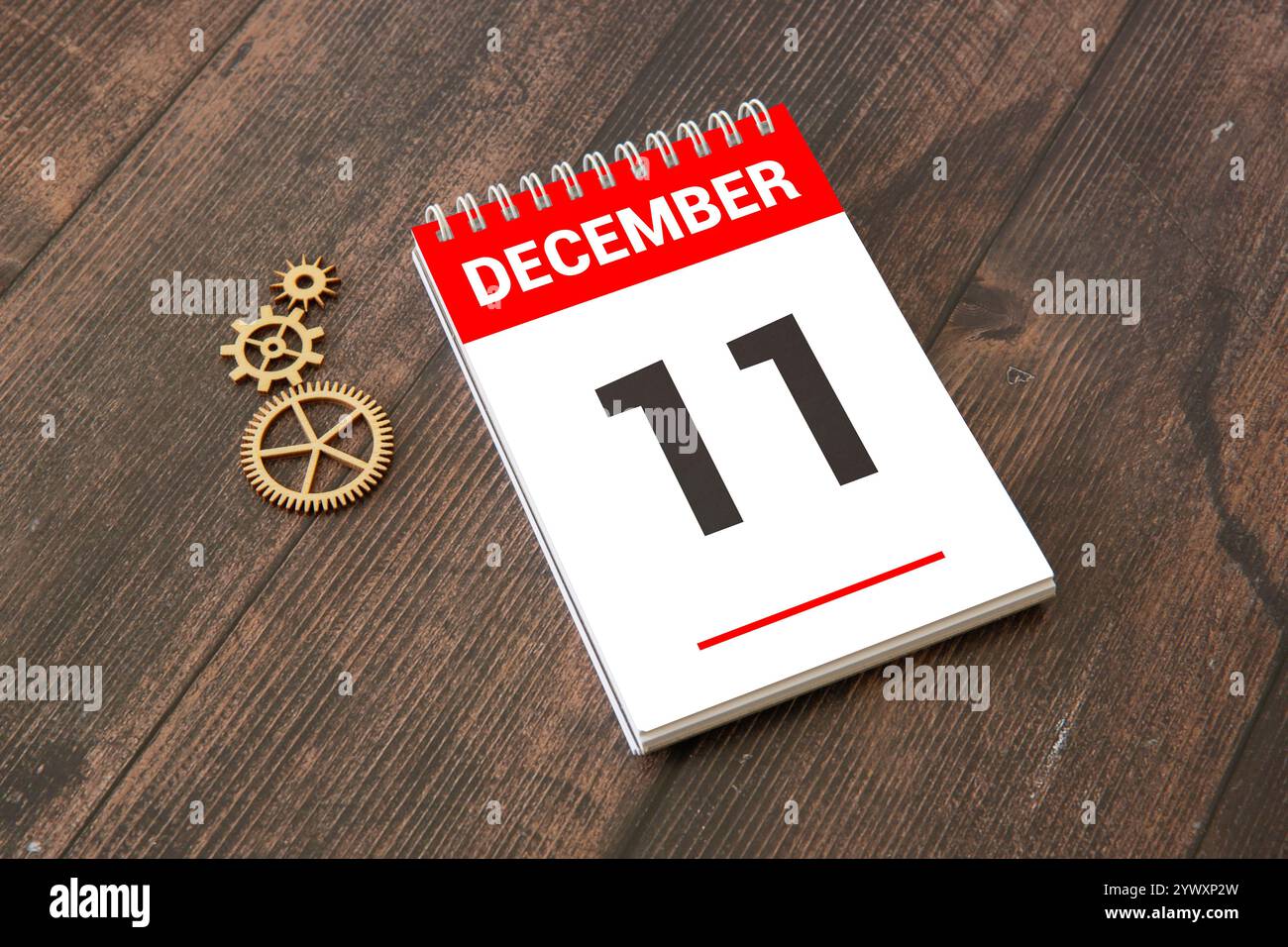 Wooden calendar, a set of dates of the month 11 January, on a white and ...