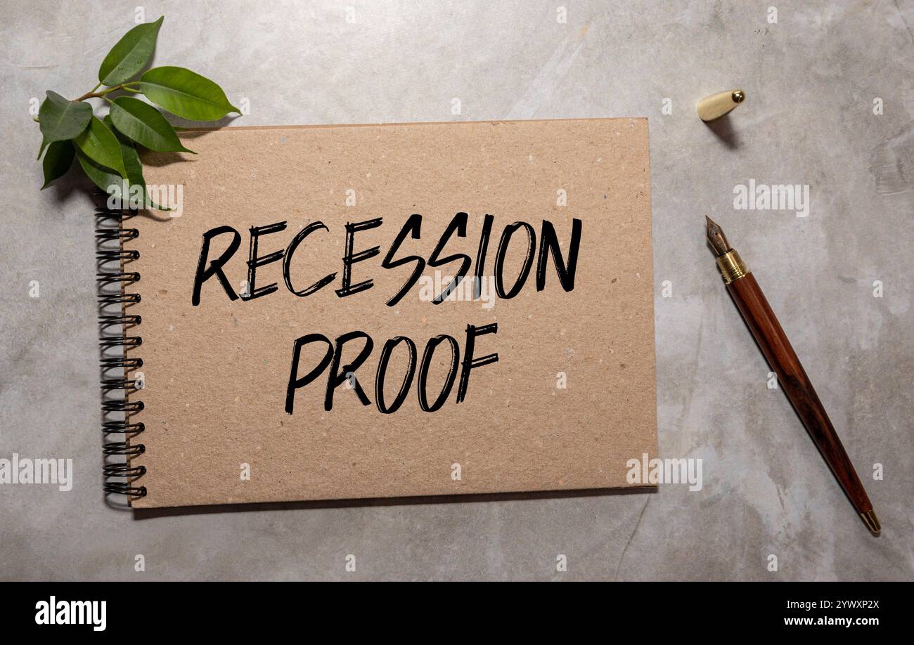 recession proof - red stencil text on a paper price tag against ...