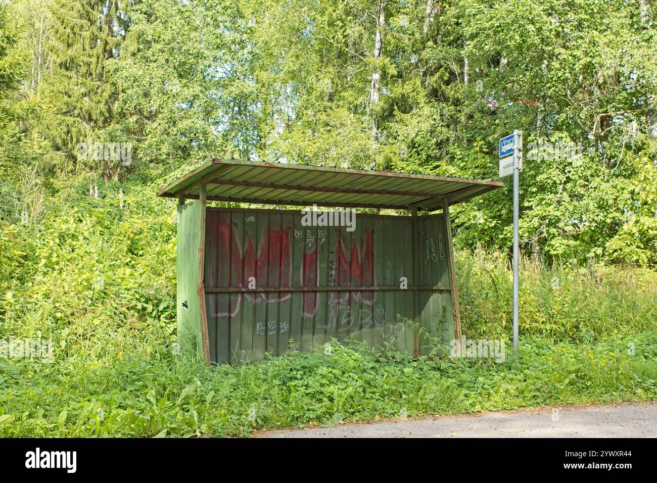 Old rural bus stop shelterwith graffiti in summer, Haimoo, Finland ...
