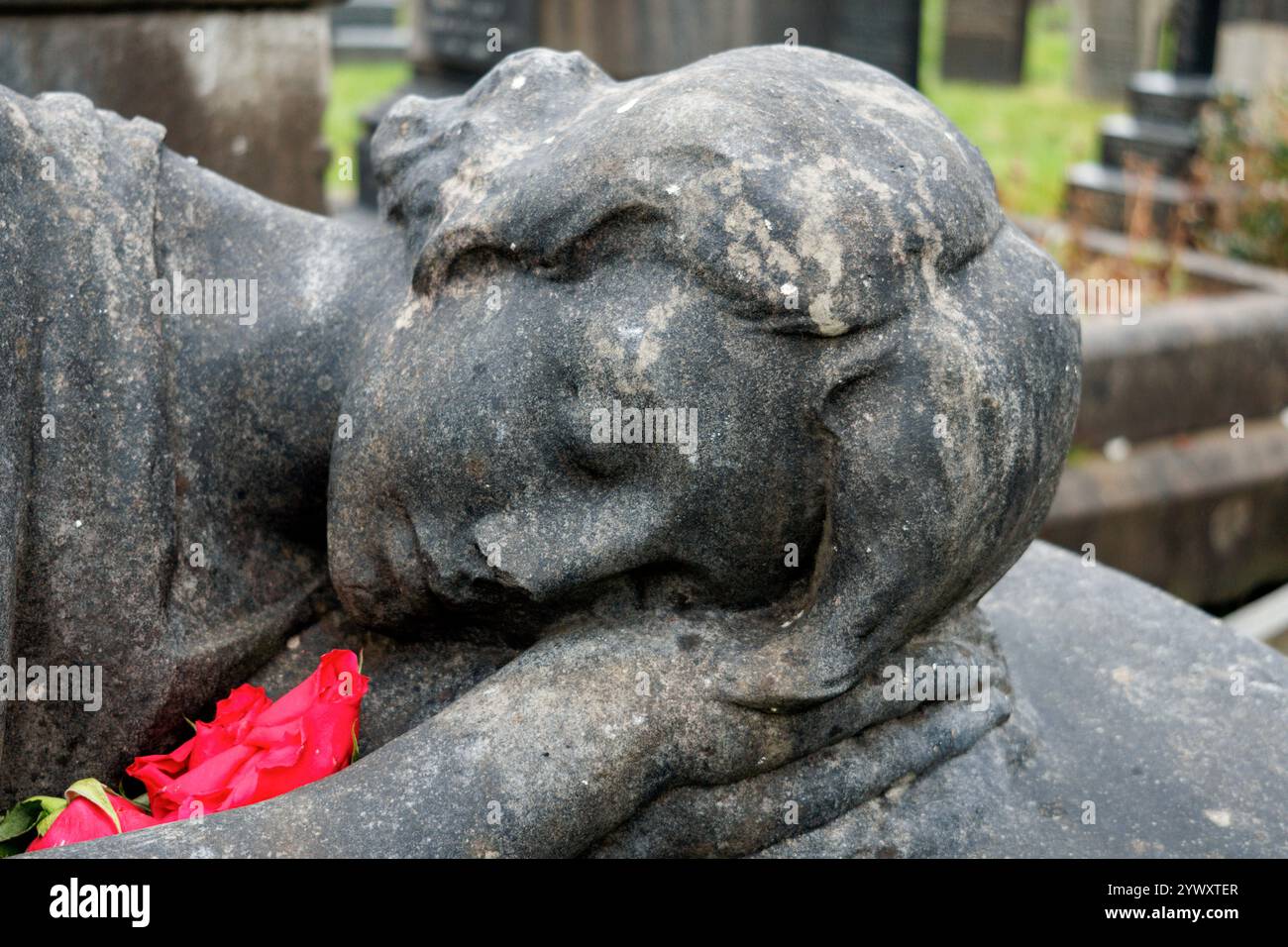 Statue on a Victorian gravestone at Preston cemetery Stock Photo - Alamy