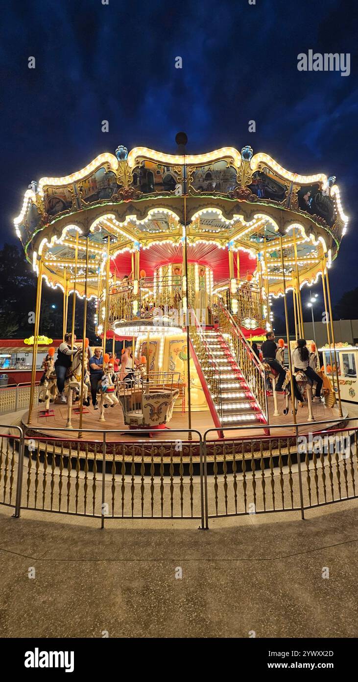 Mexico City, Mexico - Mar 20 2024: Two-story carousel with moving rides ...