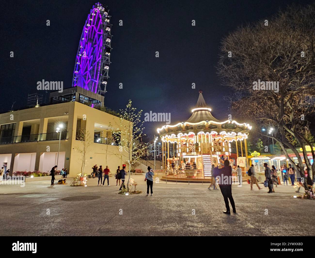 Mexico City, Mexico - Mar 20 2024: Two-story carousel with moving rides ...